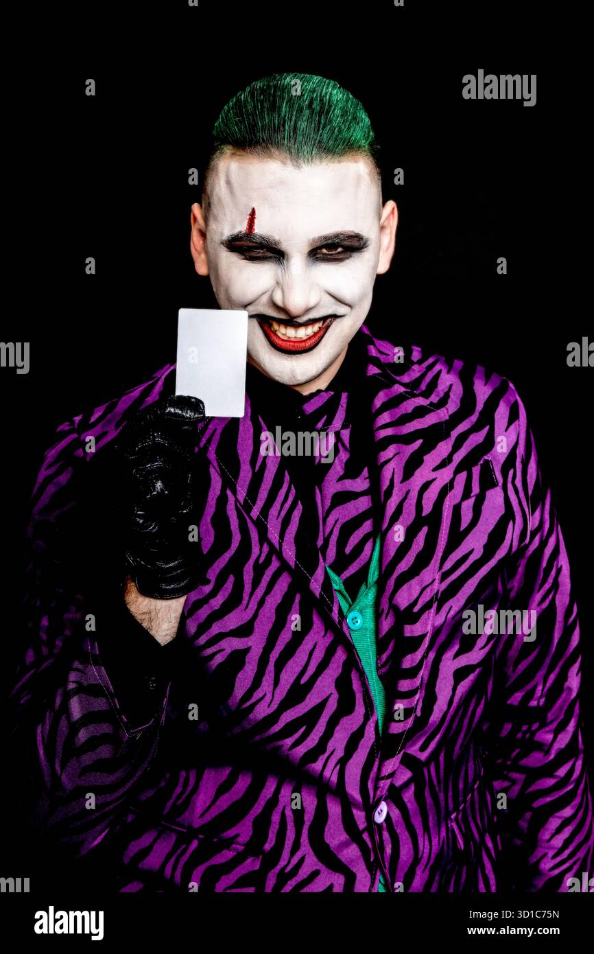 Scary clown is posing in studio on the isolated background. Halloween ...