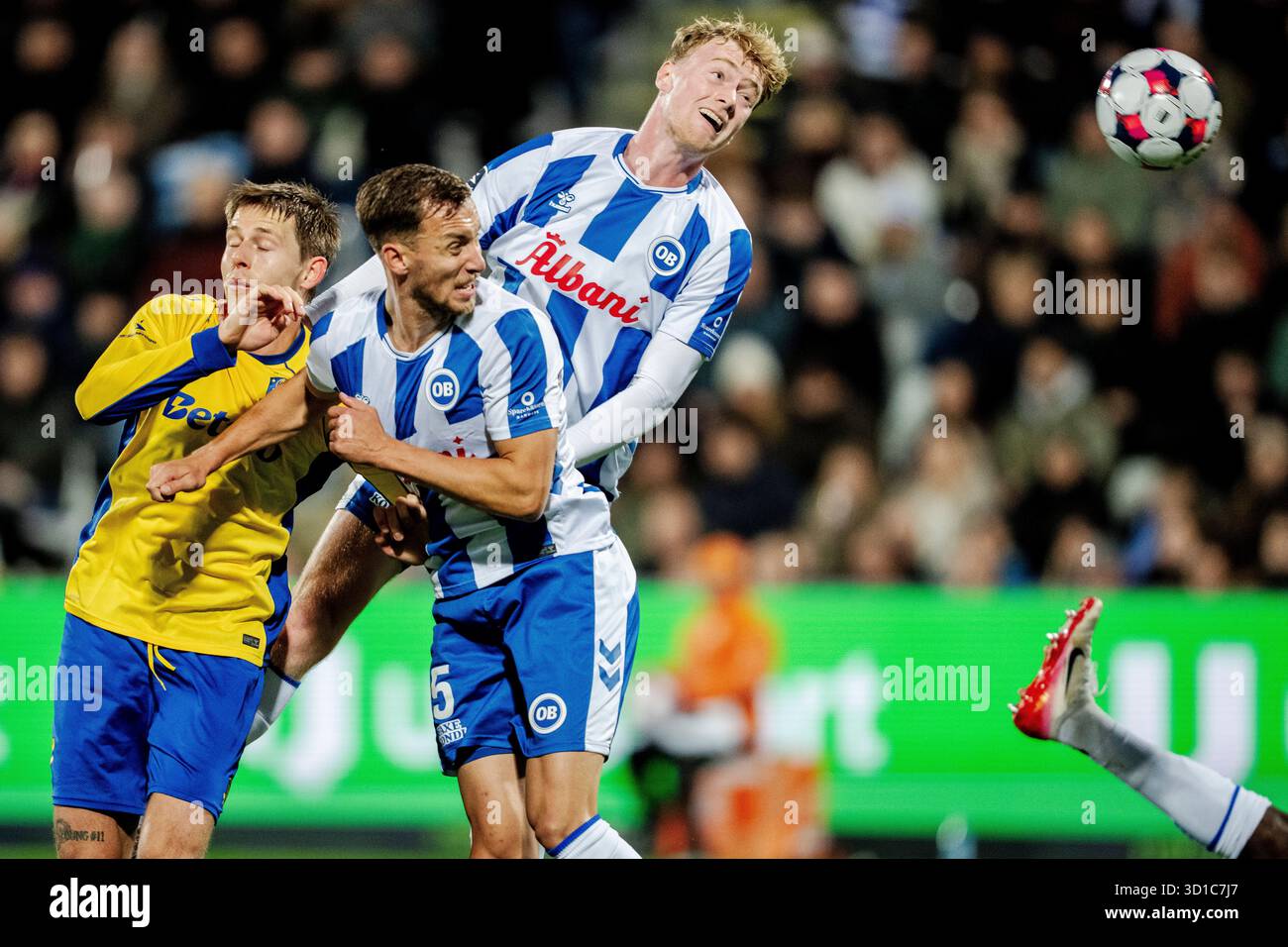 Broendby IF's Benjamin Tahirovic, OB's Nicolas Burgy and Julius Berthel ...