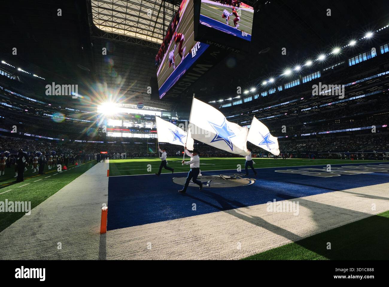 The Dallas Cowboys flag runners celebrate a score during an NFL ...