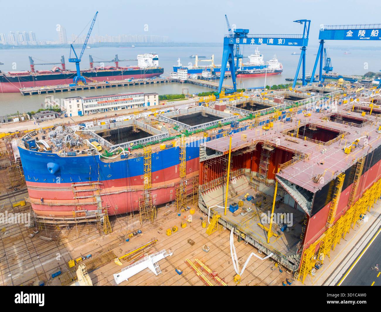 Workers are building large ships at the Nanjing Jinling Shipyard of ...
