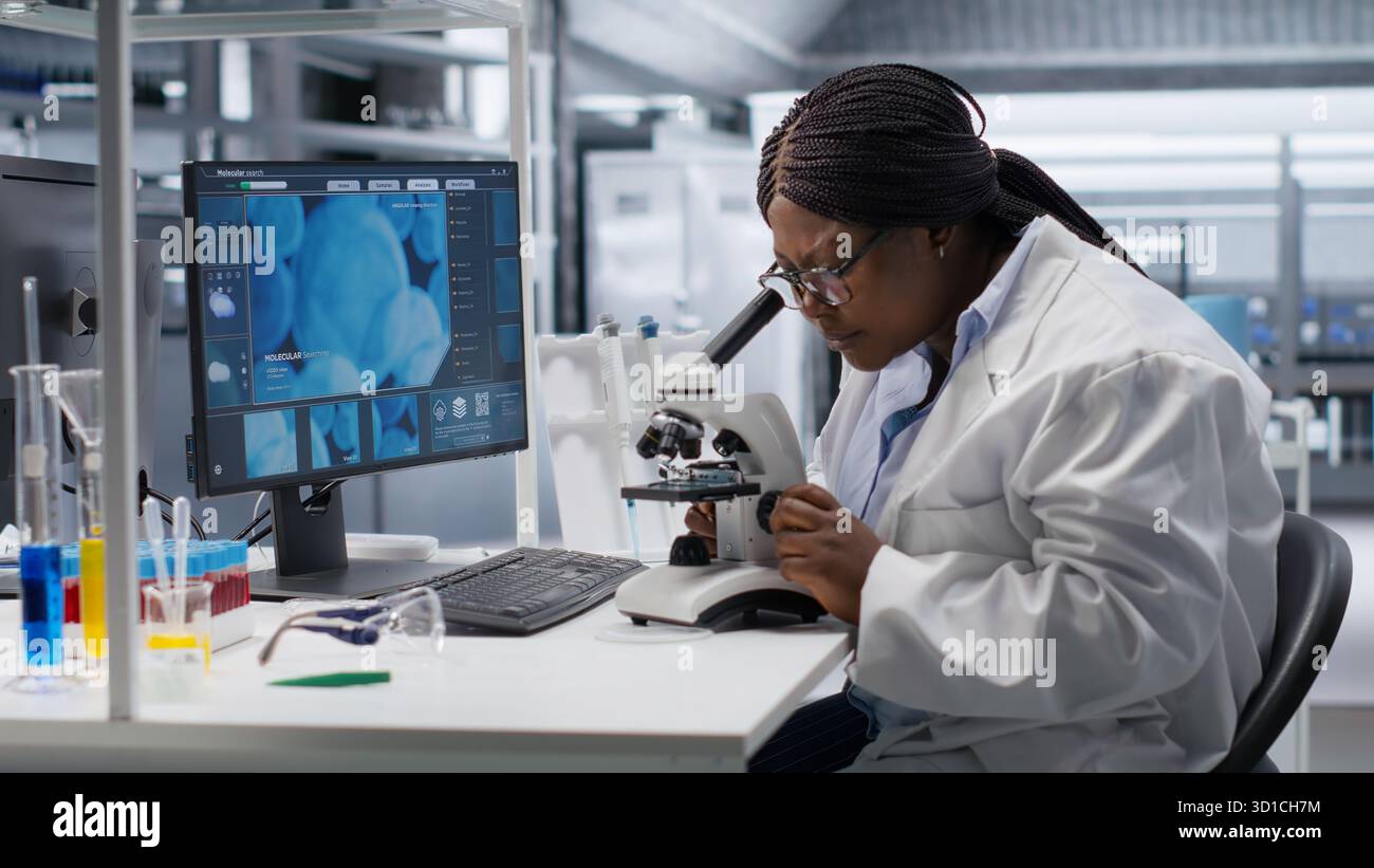 African american woman analyzing molecular samples in a bio lab, using ...