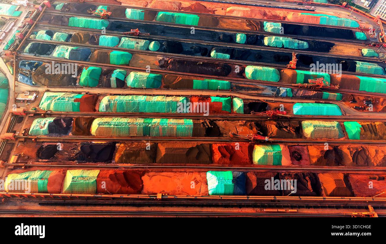 Imported iron ore piled up at the Qingdao Port ore terminal in Qingdao ...