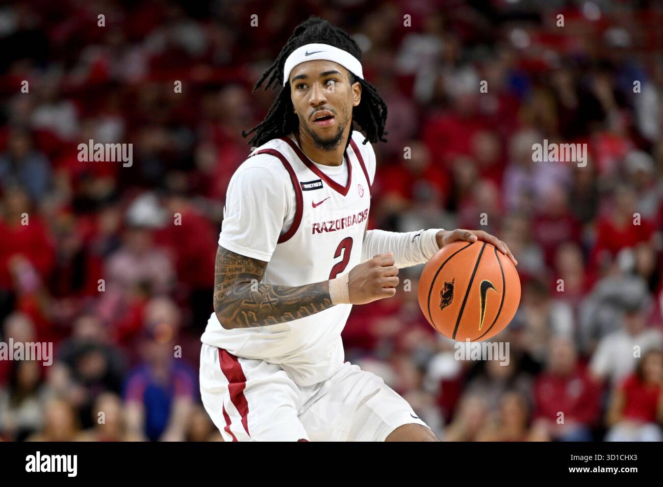 FILE - Arkansas guard Boogie Fland (2) runs a play against Florida ...