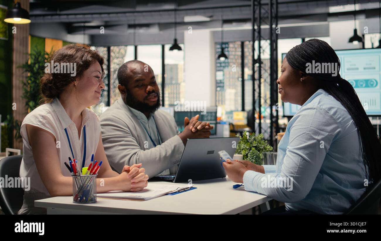 HR team giving ID security card to new hire after the job interview ...