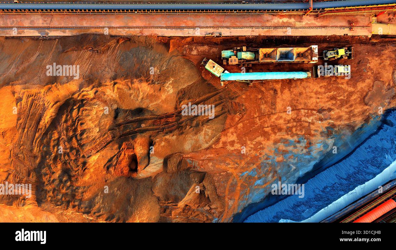 Mechanical equipment is sorting and loading imported iron ore at ...