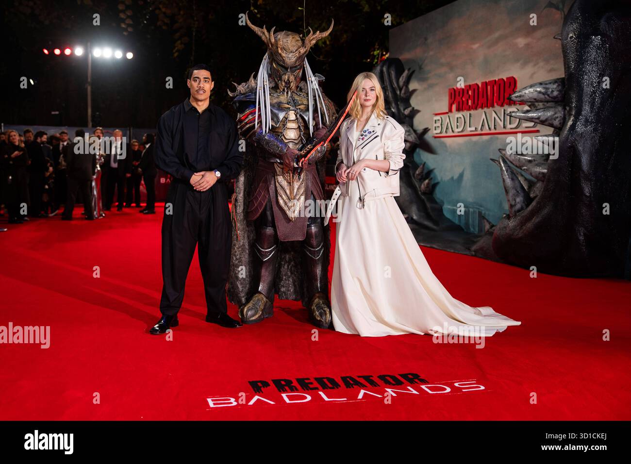 Dimitrius Koloamatangi, left, and Elle Fanning poses for photographers ...