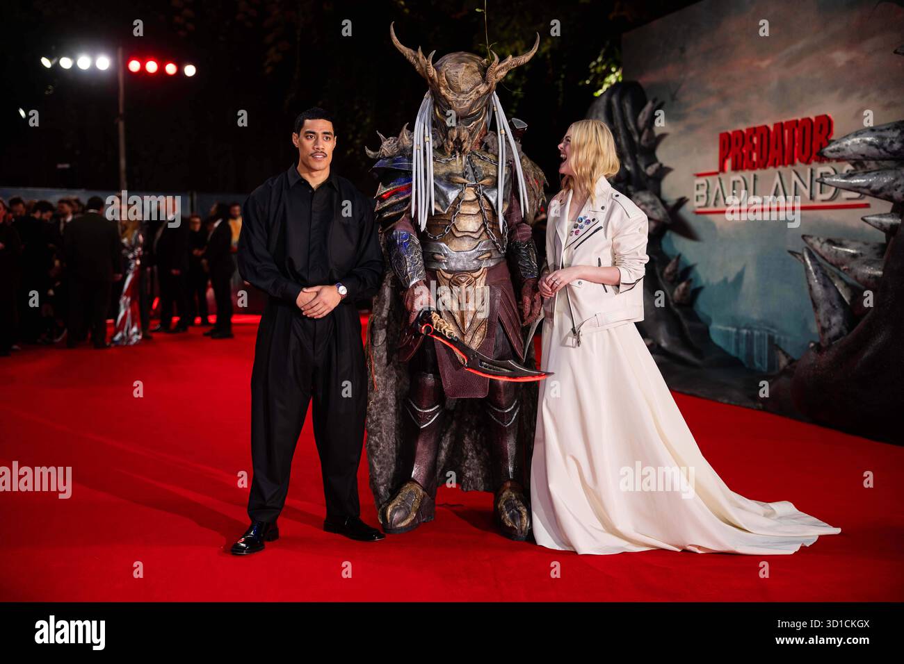 Dimitrius Koloamatangi, left, and Elle Fanning poses for photographers ...