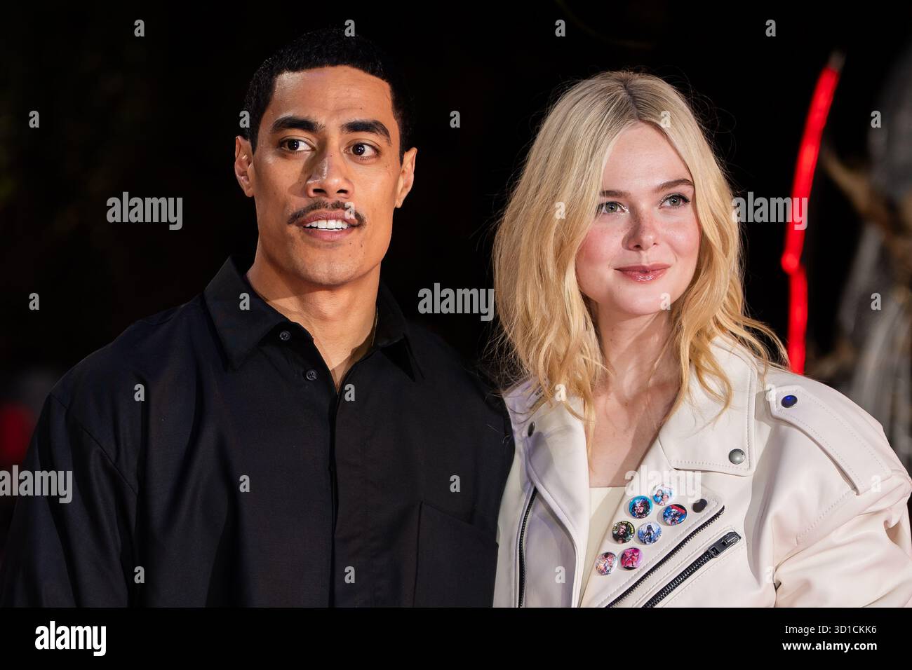Dimitrius Koloamatangi, left, and Elle Fanning poses for photographers ...