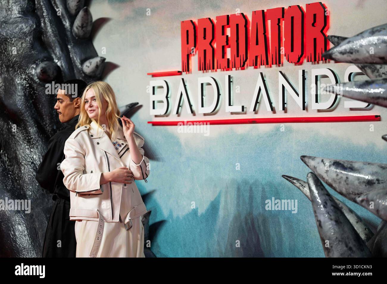 Dimitrius Koloamatangi, left, and Elle Fanning poses for photographers ...