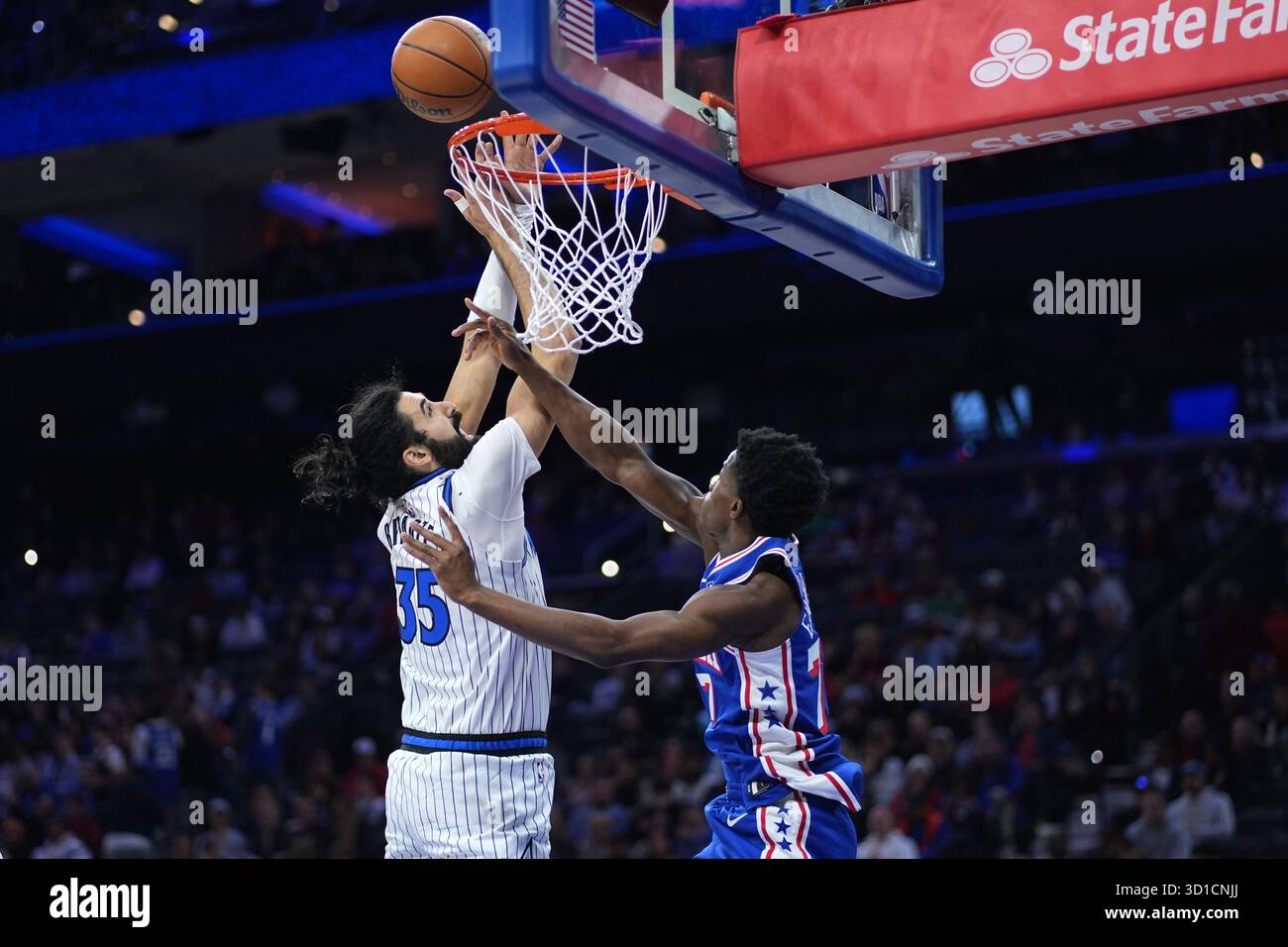 Orlando Magic's Goga Bitadze, left, tries to get a shot past ...