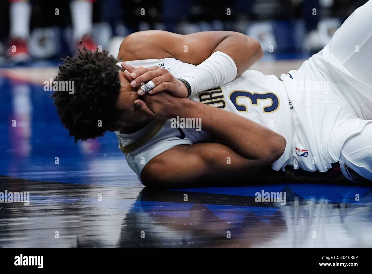 New Orleans Pelicans guard Jordan Poole (3) lies on the court after ...