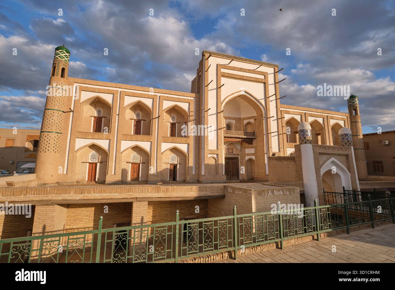 The front facade, entrance of the white Amir tura Madrasah muslim ...