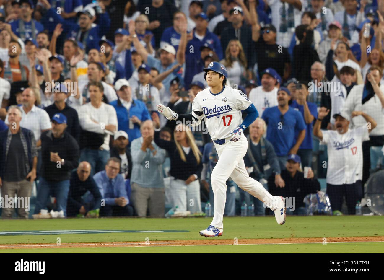 Los Angeles Dodgers designated hitter Shohei Ohtani (17) runs the bases ...