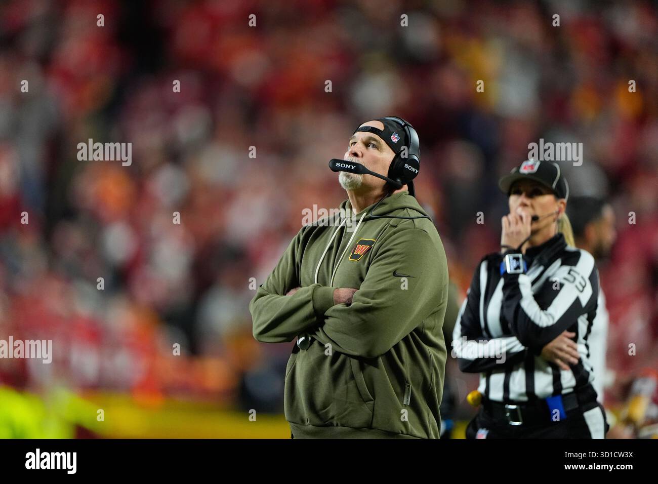 Washington Commanders head coach Dan Quinn watches a replay of a catch ...