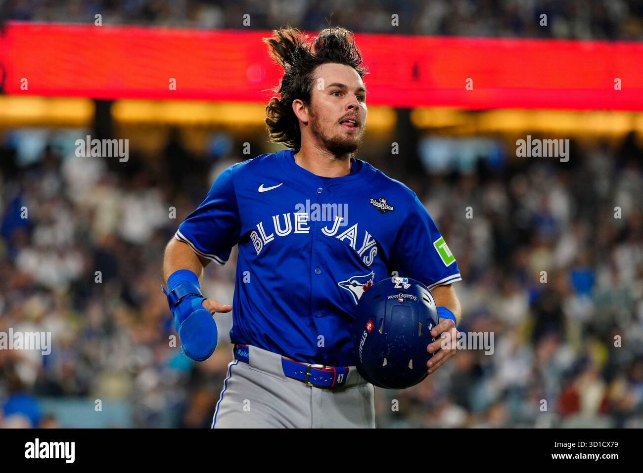 Toronto Blue Jays' Addison Barger (47) scores on a sacrifice fly during ...