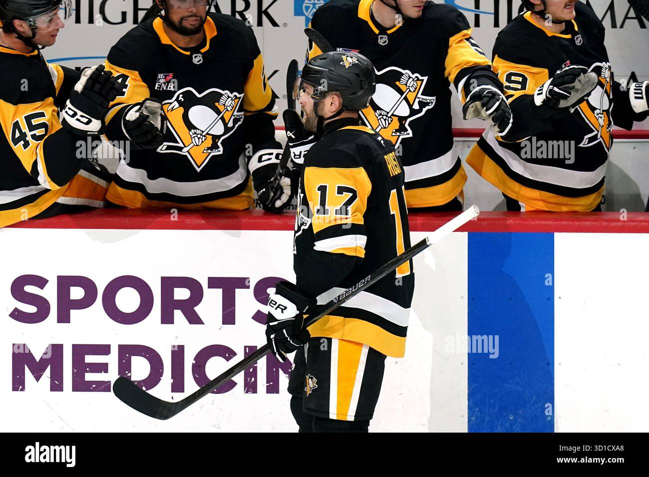 Pittsburgh Penguins' Bryan Rust (17) returns to the bench after scoring ...