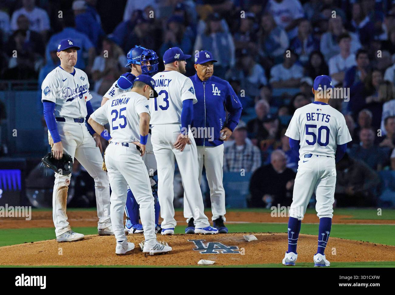 Los Angeles Dodgers manager Dave Roberts and members of the infield ...
