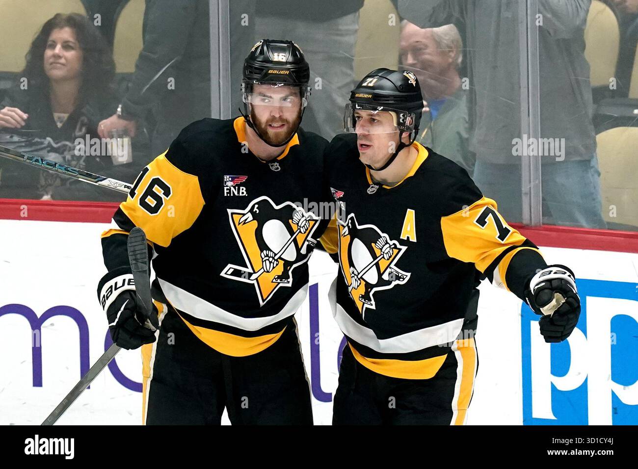 Pittsburgh Penguins' Evgeni Malkin (71) celebrates with Justin Brazeau ...