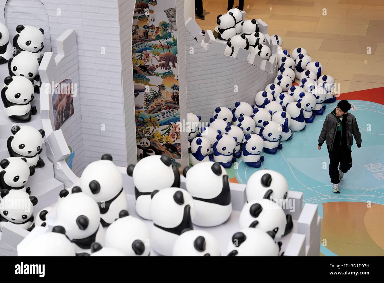 Beijing,China.27th October 2025. A teenager views an art installation ...