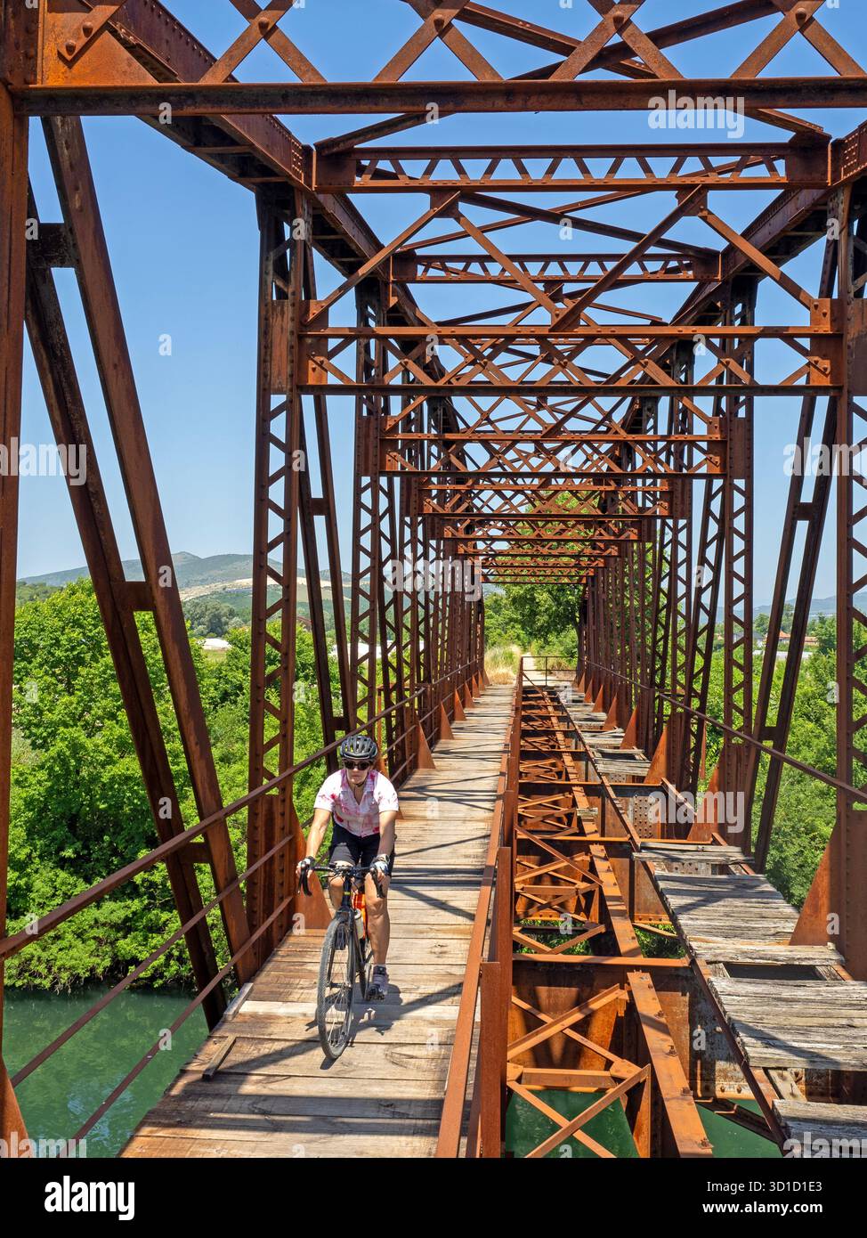 Cyclist crossing an old railway bridge on the Ciro Rail Trail Stock ...