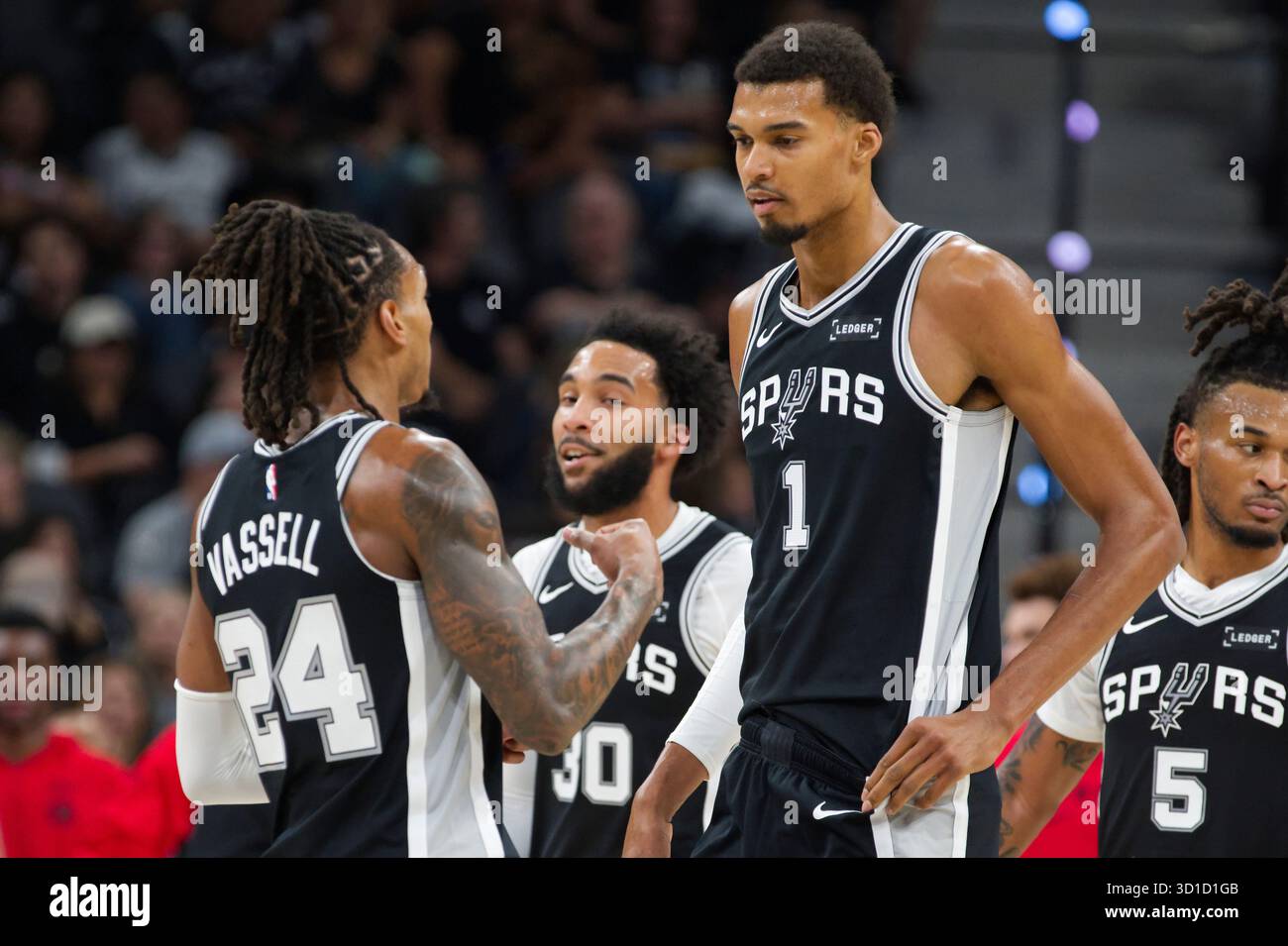 San Antonio Spurs center Victor Wembanyama (1) speaks with Spurs guard ...