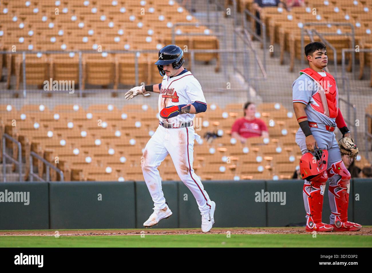 Glendale Desert Dogs outfielder Patrick Clohisy (24) scores in the ...