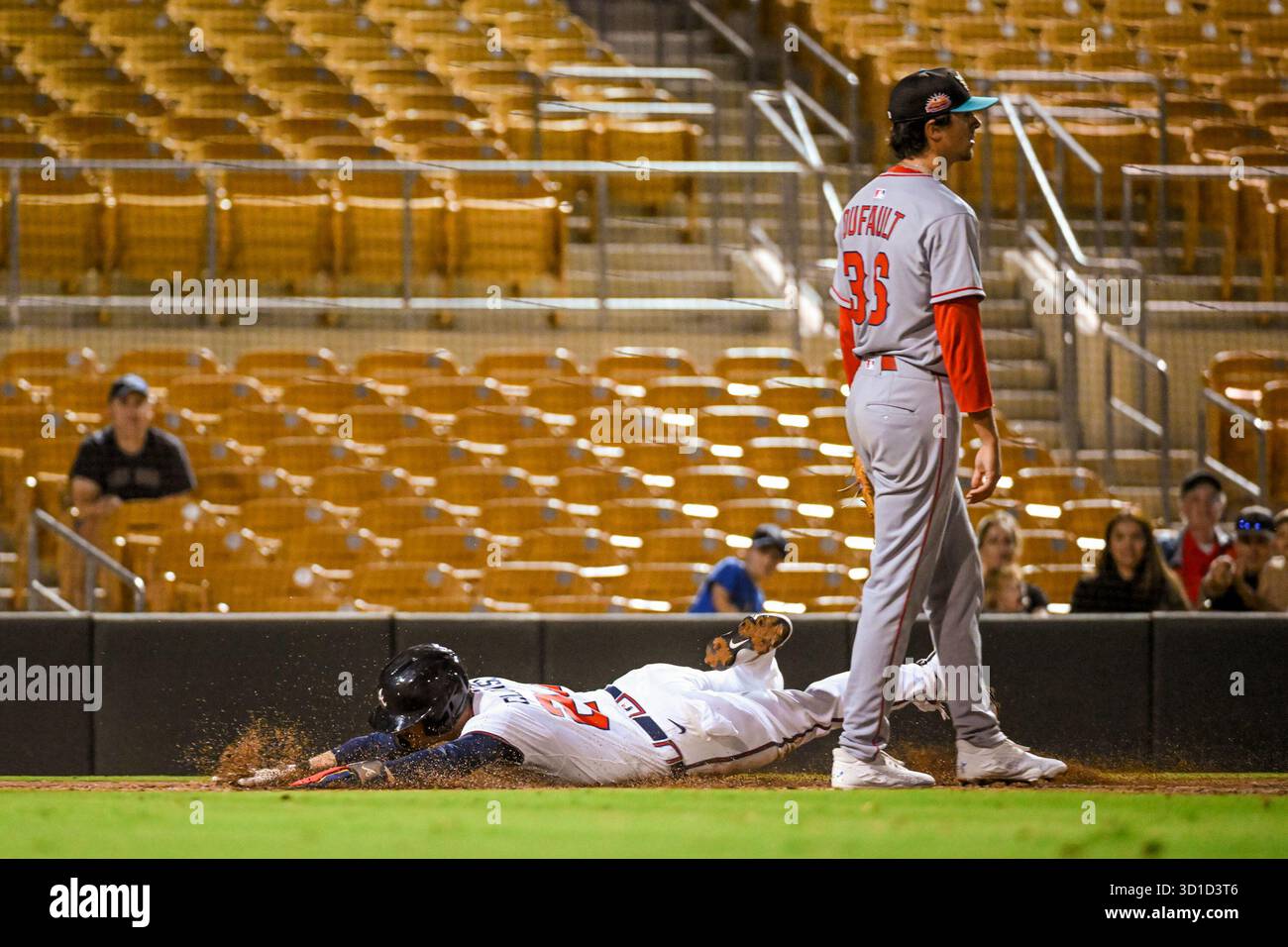 Glendale Desert Dogs outfielder Patrick Clohisy (24) scores in the ...