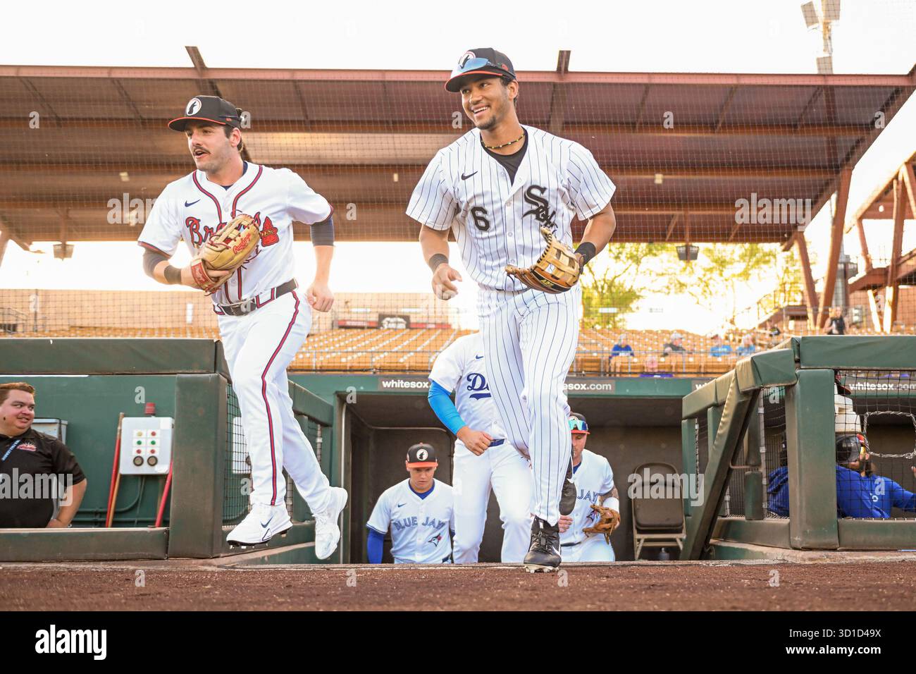 Glendale Desert Dogs outfielders Partick Clohisy (24) and Braden ...