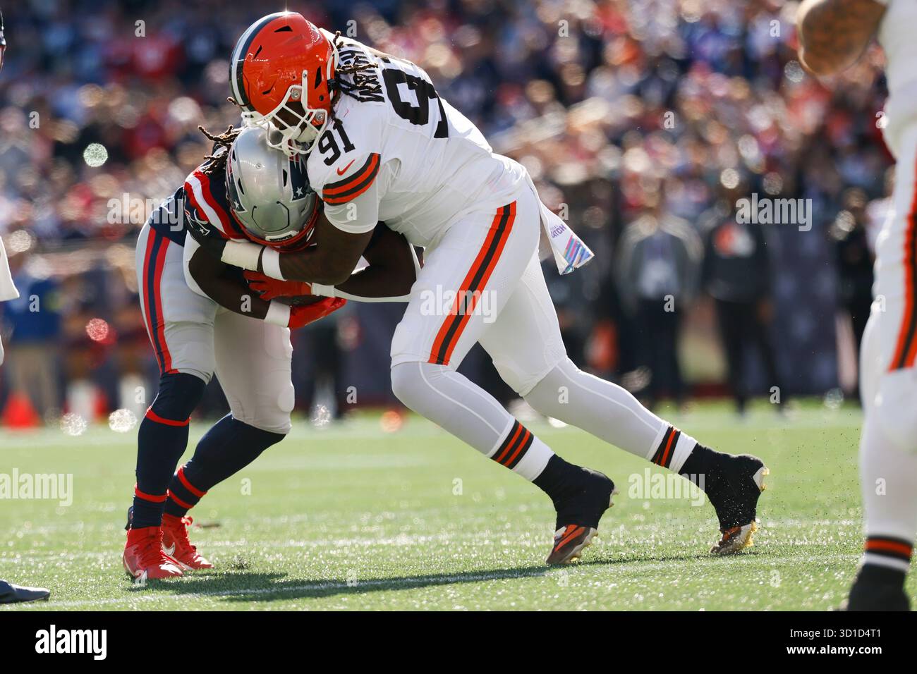 New England Patriots running back Rhamondre Stevenson (38) is tackled ...