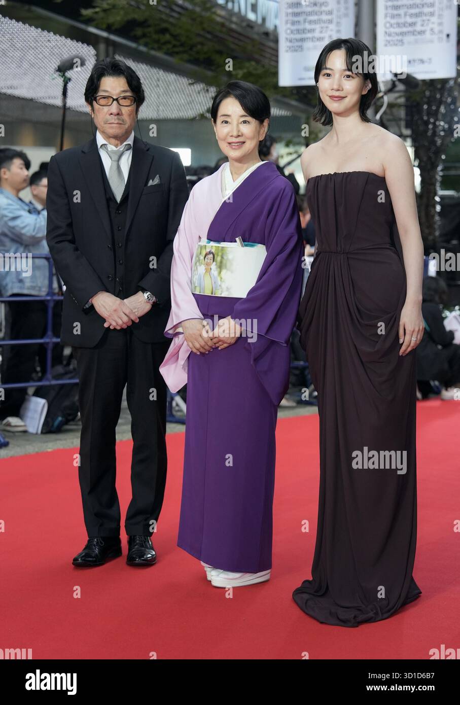 (From L) film director Junji Sakamoto and actresses Sayuri Yoshinaga and Non appear on the red ...