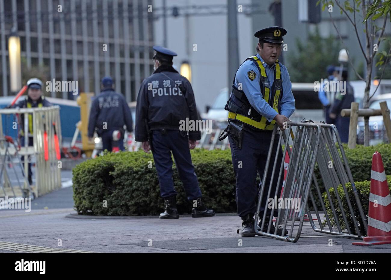 Police officers stand guard near the U.S. Embassy in Tokyo on Oct. 28 ...