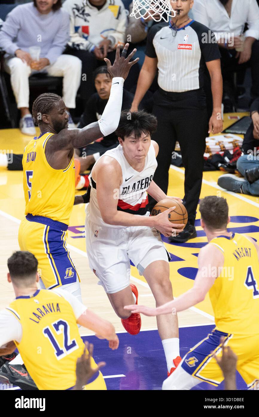 Portland Trail Blazers' Yang Hansen (16) drives past Los Angeles Lakers ...
