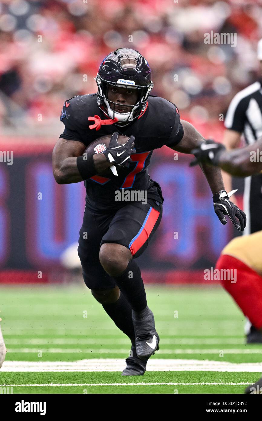 Houston Texans running back Woody Marks (27) runs the ball against the ...
