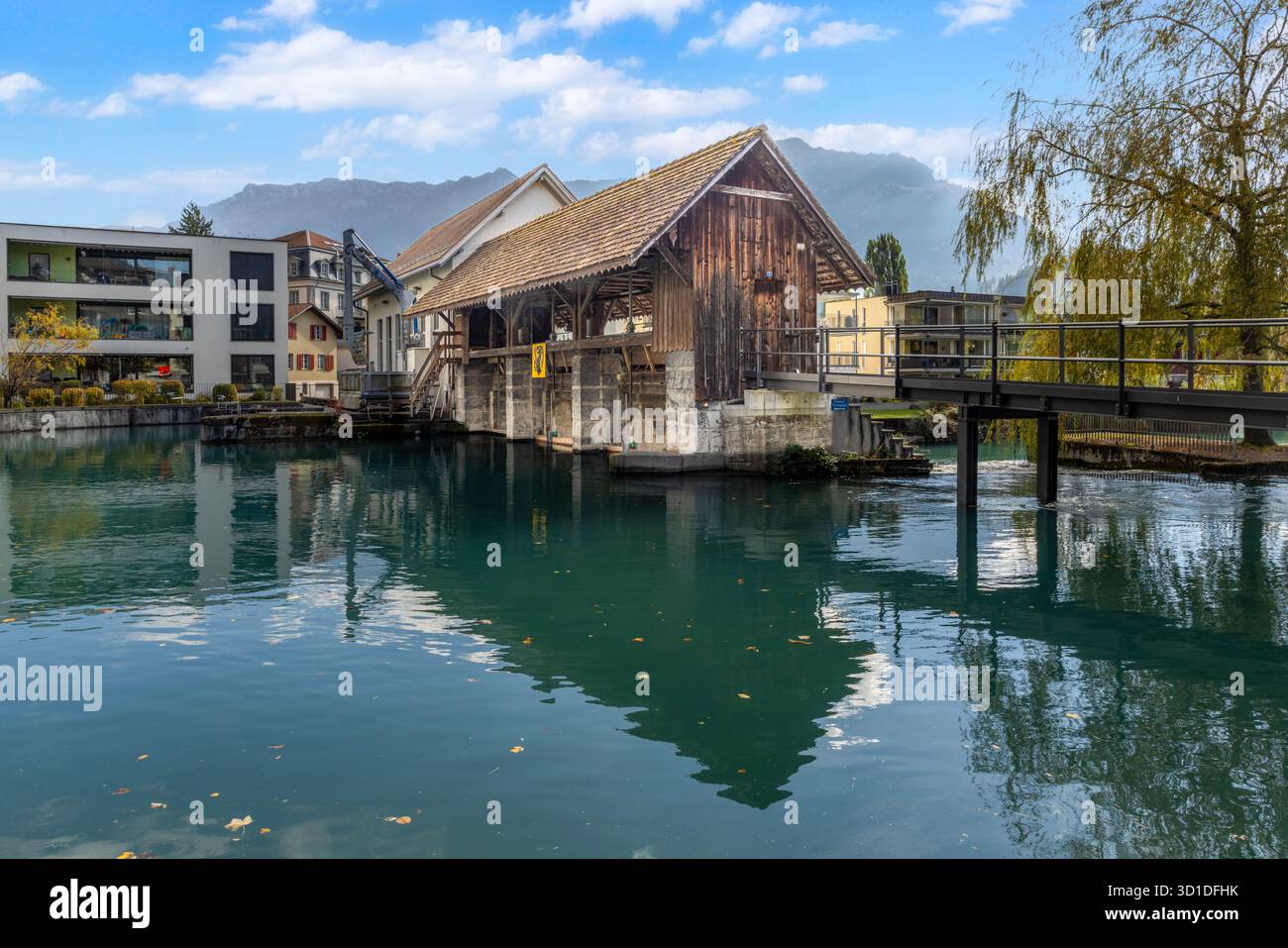 The resort town of Interlaken, set between two lakes and bisected by ...