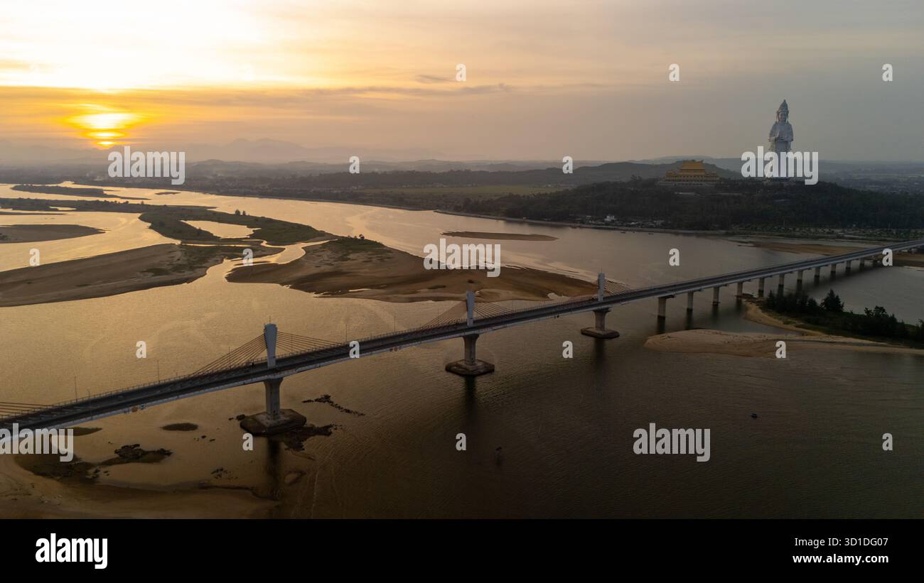 Aerial Sunset over Tra Khuc River Bridge and Ba Vang Buddha, Quang Ngai ...