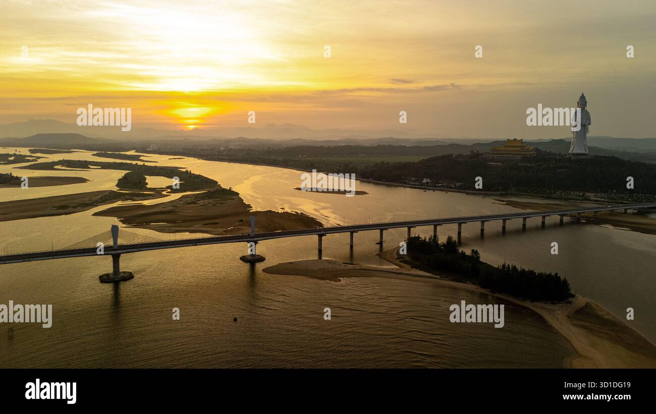 Aerial Sunset over Tra Khuc River Bridge and Ba Vang Buddha, Quang Ngai ...