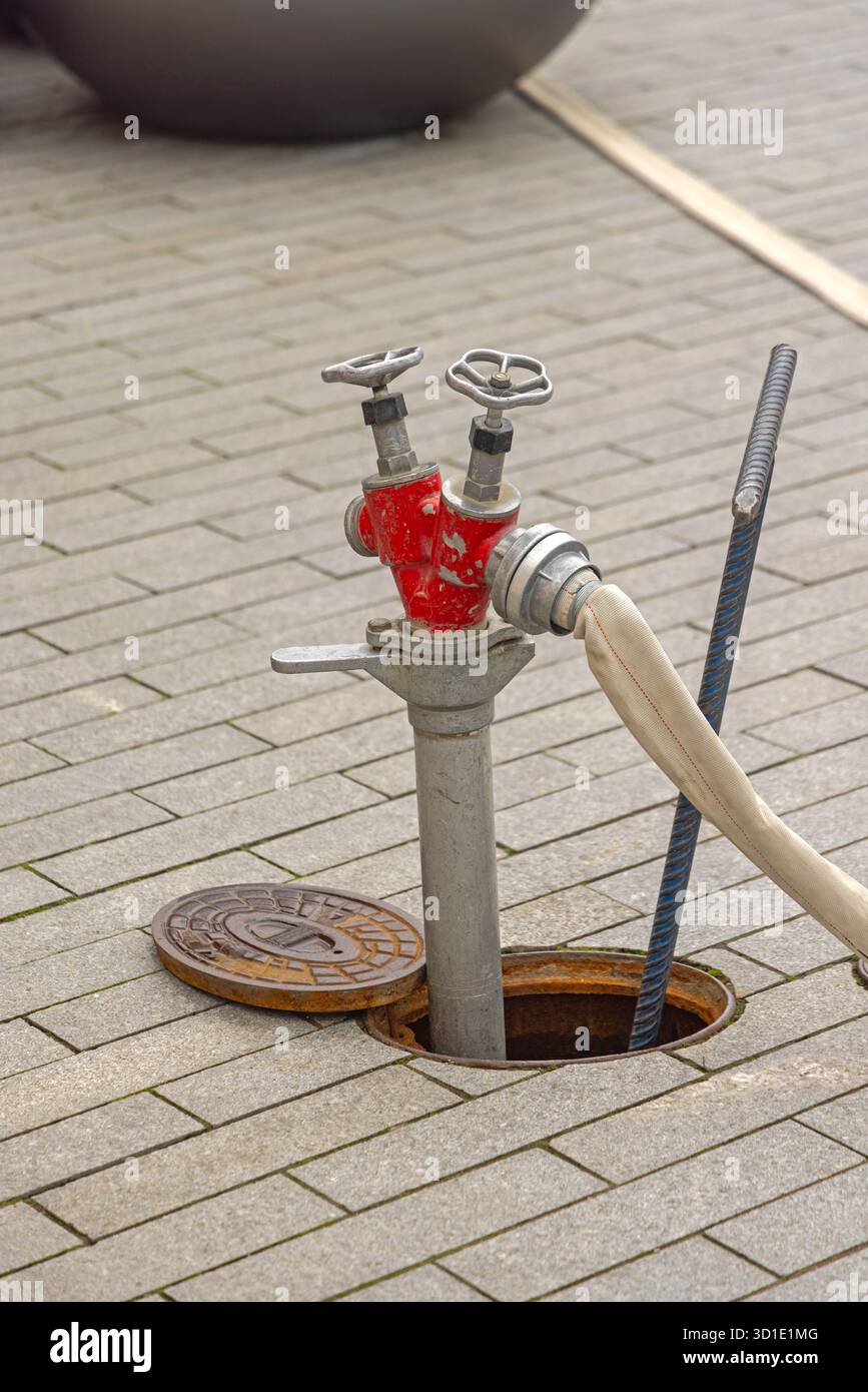 Temporary Pipe Water Hydrant From Open Utility Shaft Manhole in Street ...