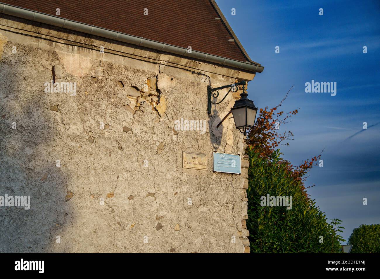 A close-up view of a textured stone wall in a French village, featuring ...