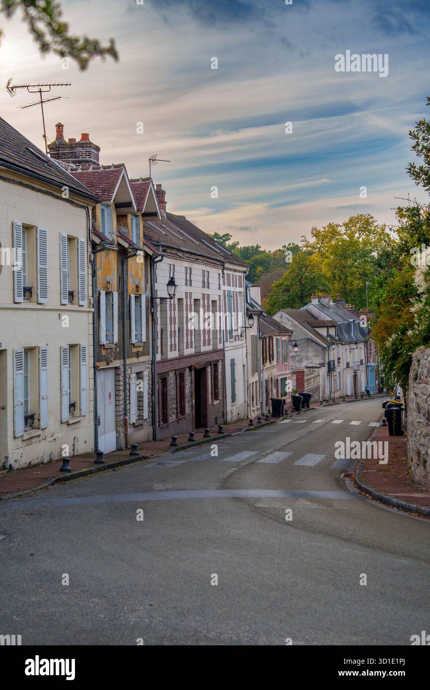 A tranquil scene of a cobblestone street in a historic European town ...