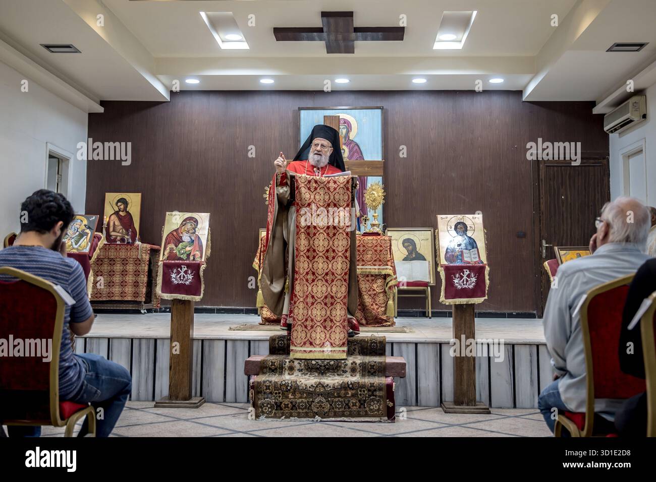 A priest speaks during a Divine Liturgy service in Mar Elias church in ...