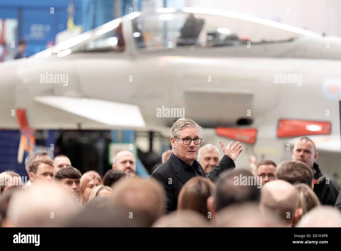 British Prime Minister Keir Starmer speaks to workers during a visit to ...