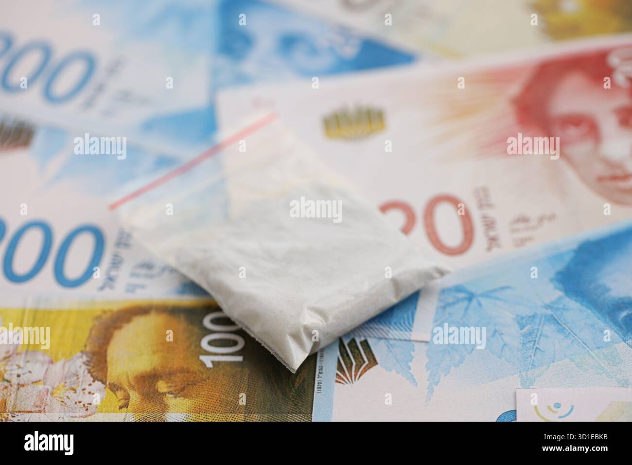 Israel New Shekels banknotes and cocaine pack. The current Israel money ...