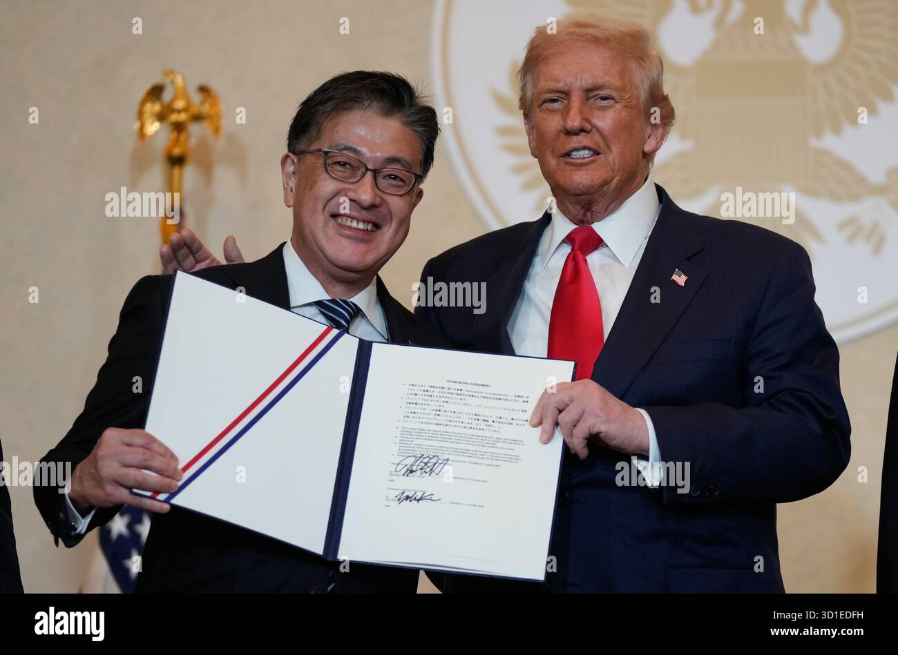 Panasonic CEO Yuki Kusumi, left, poses for a photo with President ...