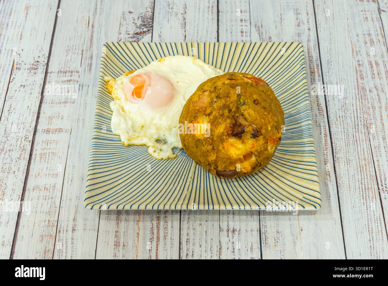 Traditional Peruvian stuffed potato with yellow potato dough and a ...