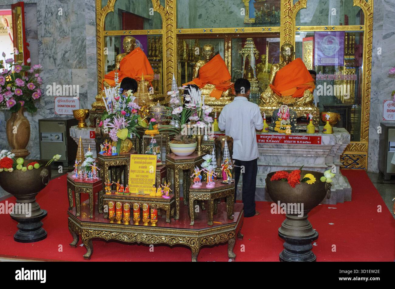 Buddhist believers Buddhists pray making offerings to statues of ...