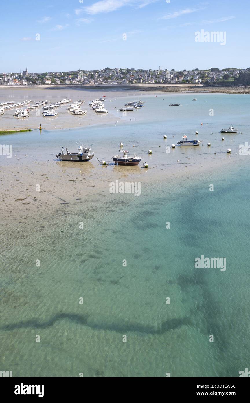 Over the shallow, turquoise water and moist sandy soil at low tide (low ...