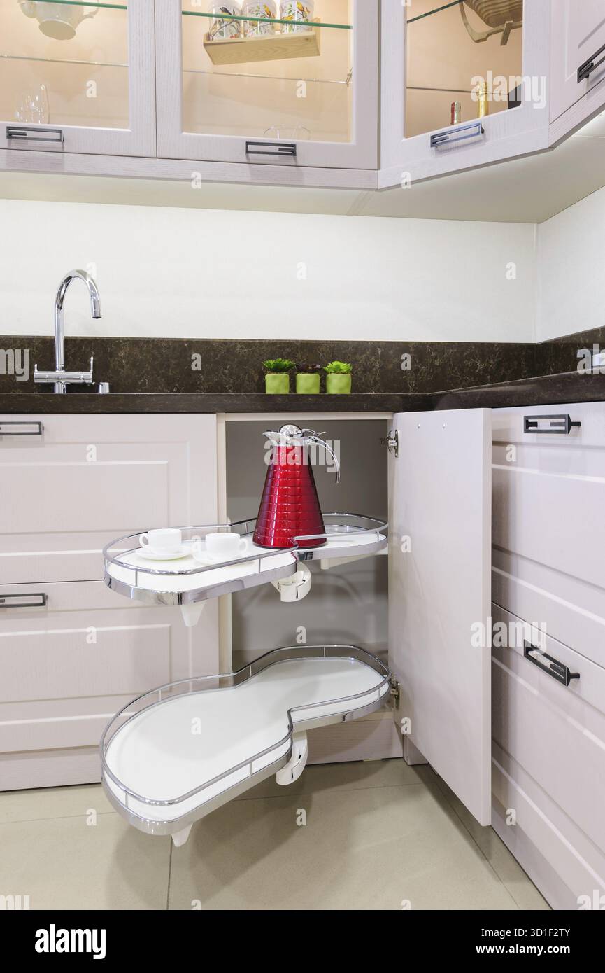 Kitchen corner storage unit with pullout shelves for cookware Stock ...