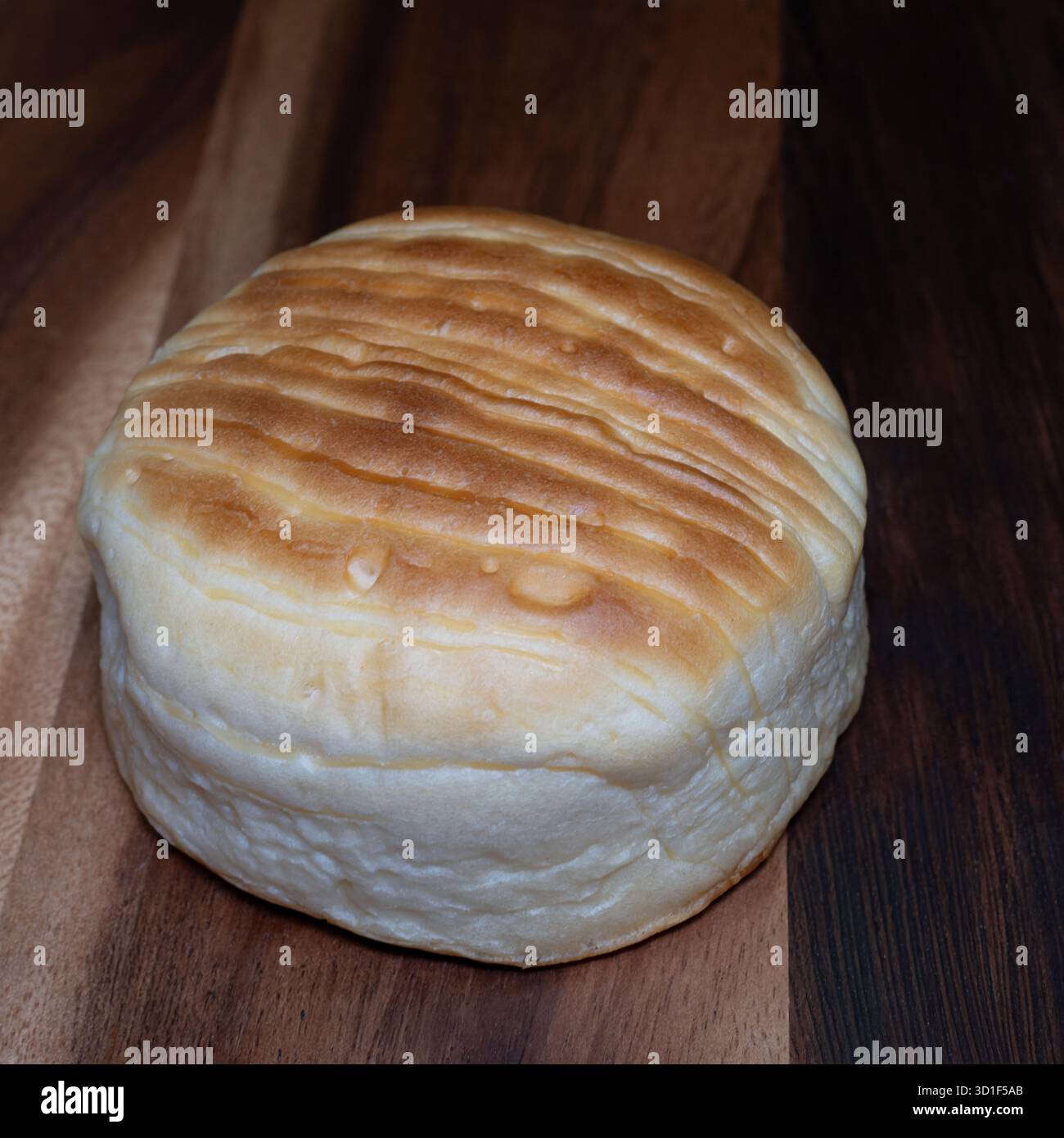 Golden brown loaf bread rests hi-res stock photography and images - Alamy
