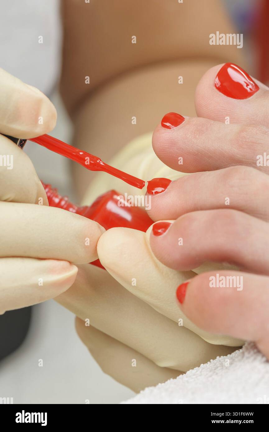 Pedicure process macro closeup, putting enamel on nails Stock Photo - Alamy