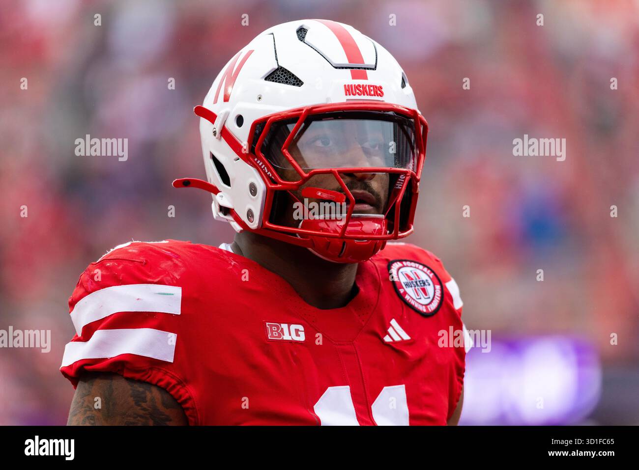 Nebraska defensive lineman Cameron Lenhardt (11) warms up before an ...
